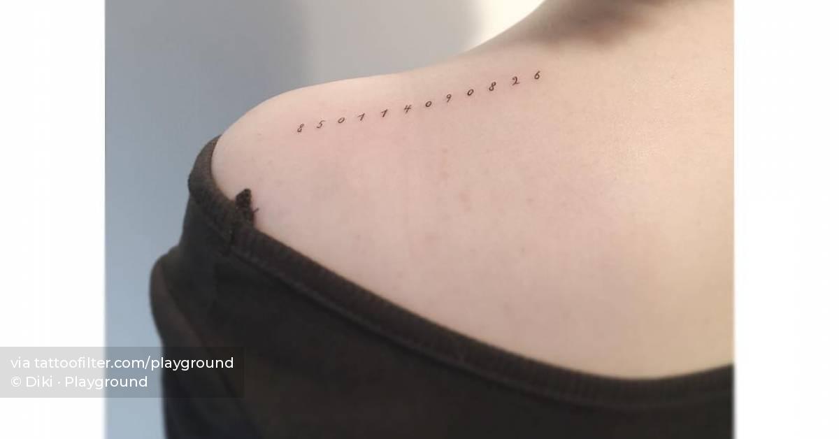 Numbers tattoo done on the top of the shoulder.