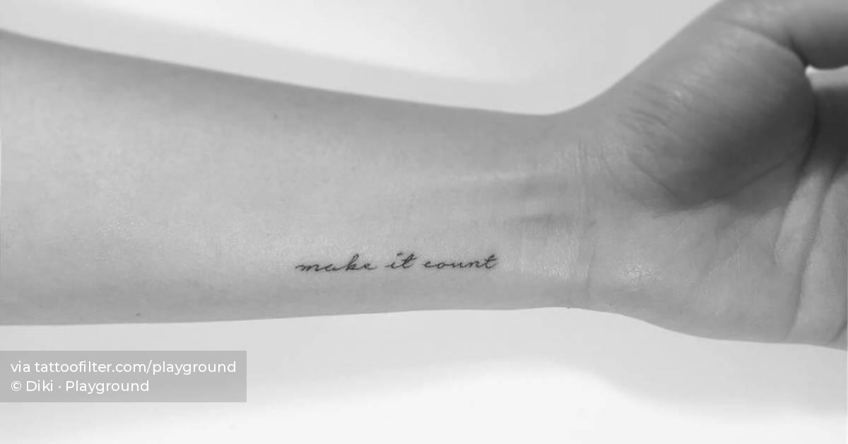 "Make it count" lettering tattoo located on the wrist.