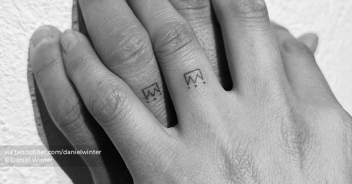 Minimalistic matching crown tattoo for couple.