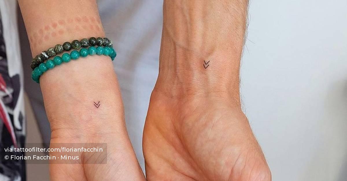 Matching kenaz rune tattoo for couple.