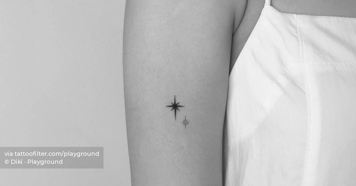 Minimalistic stars tattoo located on the upper arm.