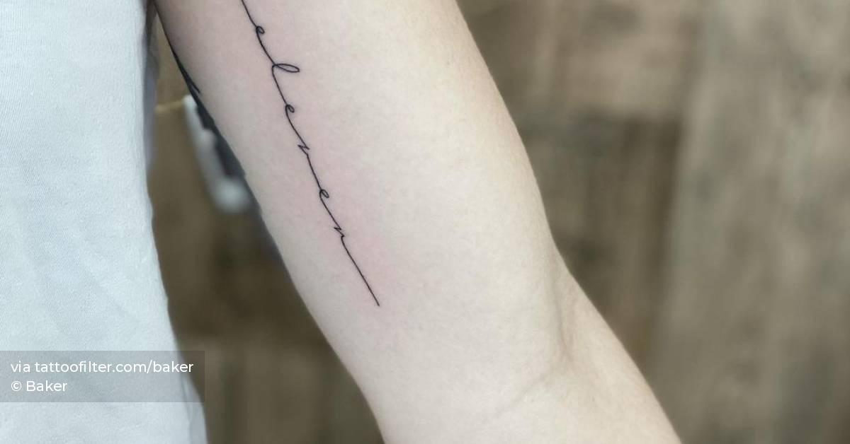"Eleven" lettering tattoo located on the inner arm.