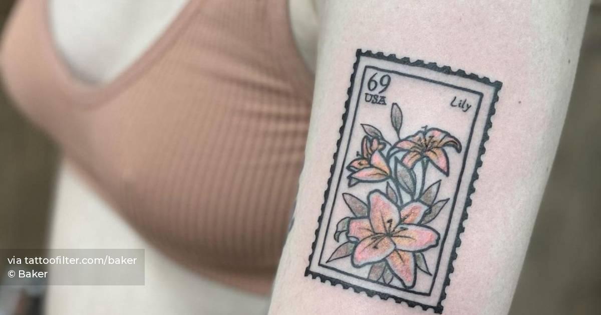 Lily stamp tattoo done on the upper arm, illustrative
