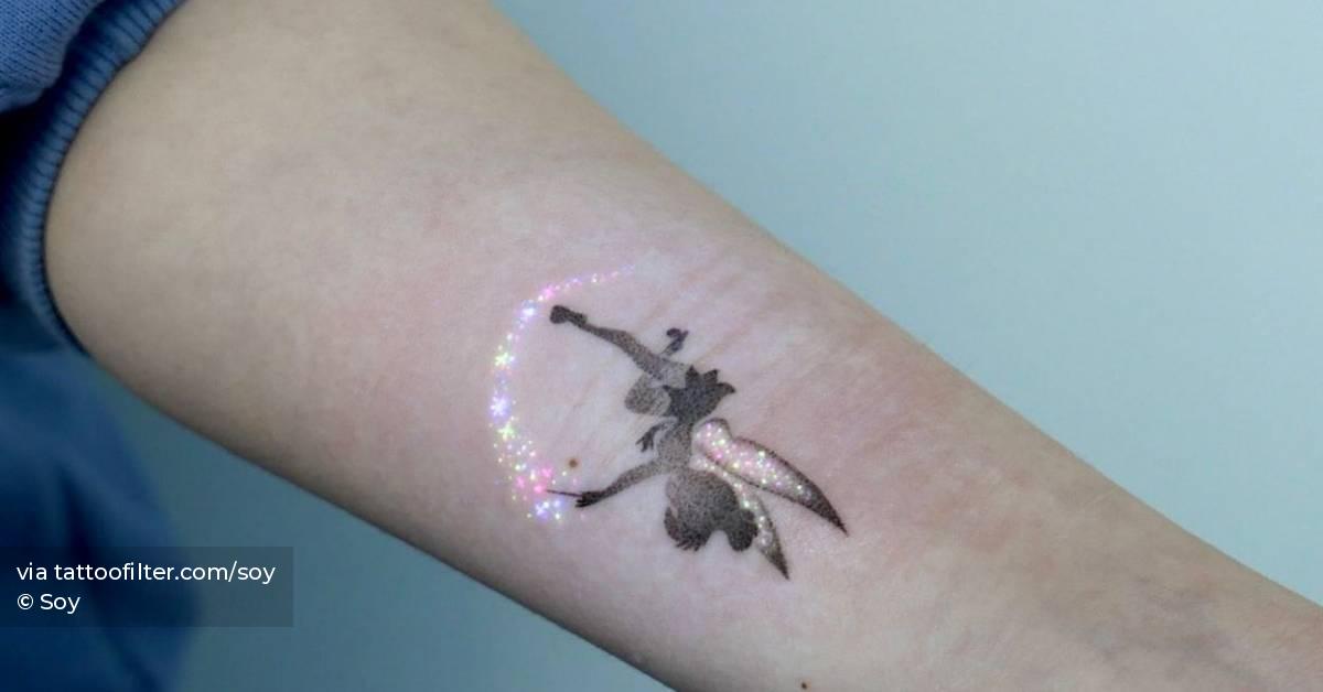 Hand poked Tinker Bell tattoo located on the forearm.