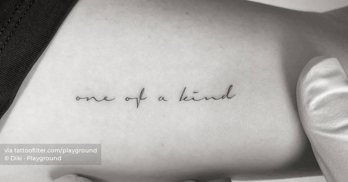 "One of a kind" lettering tattoo located on the inner