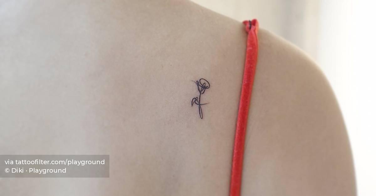 One line rose tattoo located on the shoulder blade,