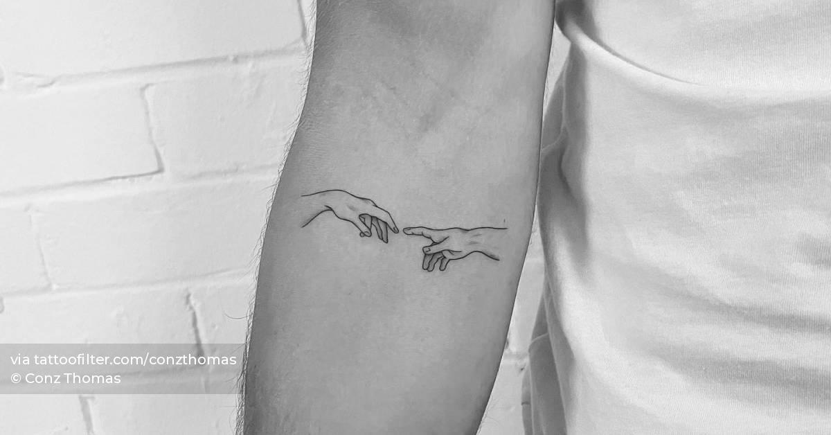 Creation of Adam piece tattooed on the inner forearm.