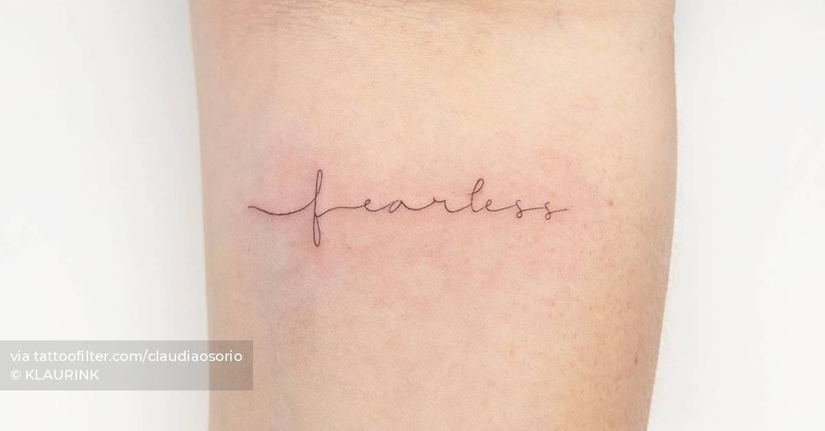 "Fearless" lettering tattoo on the inner forearm.