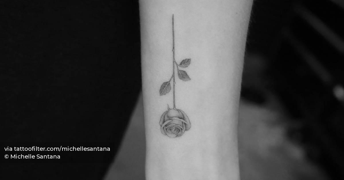Micro-realistic rose tattoo located on the inner