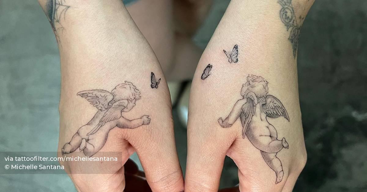 Individual matching cherubs and butterflies tattooed on