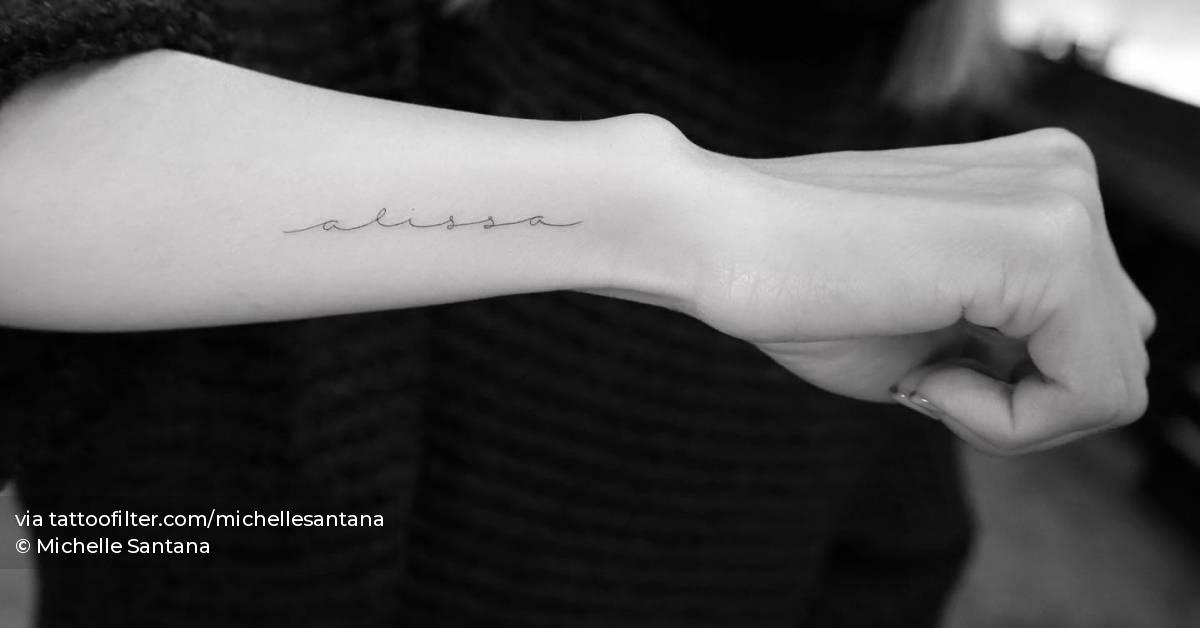 Daughter’s name "Alissa" tattooed on the wrist.