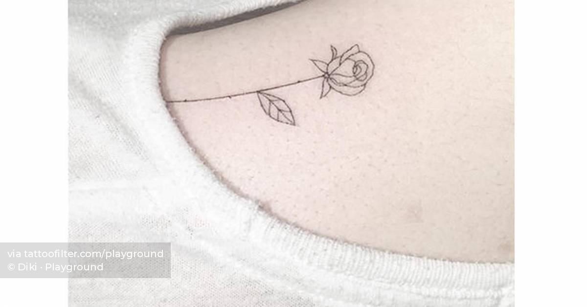 Tattoo of a rose done in fine line located on the top