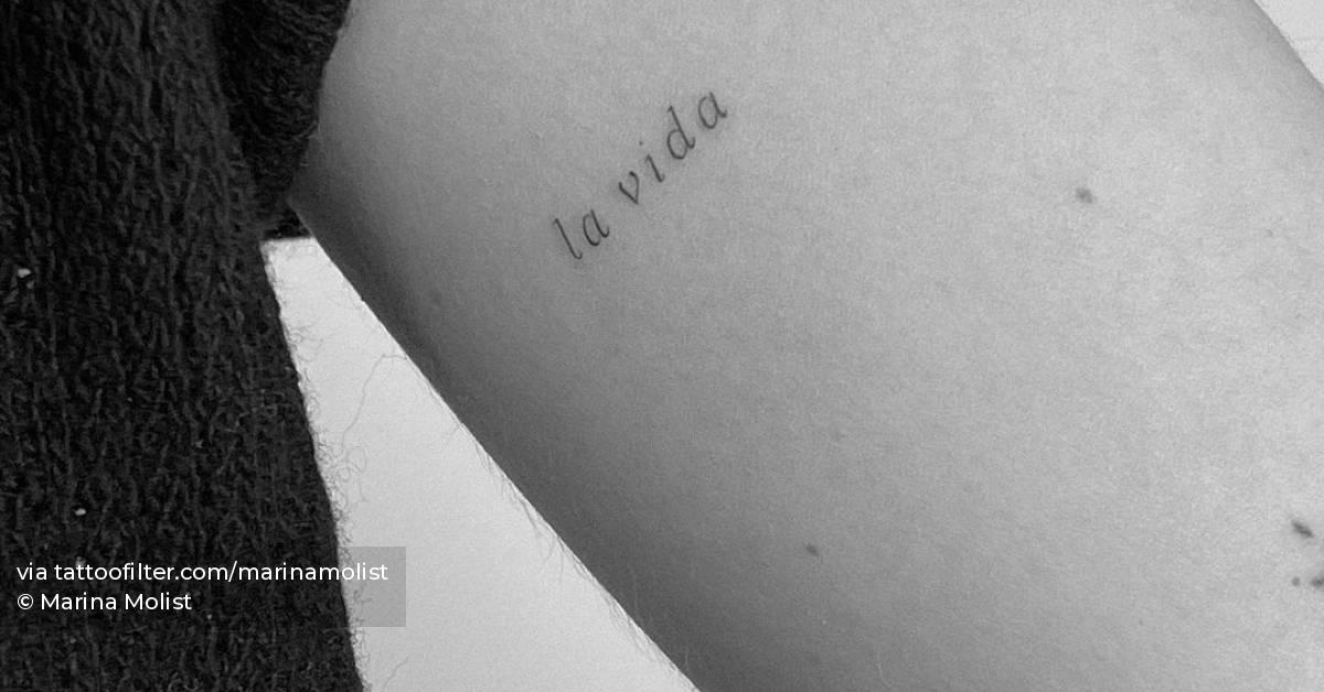 “La Vida” lettering tattoo located on the inner