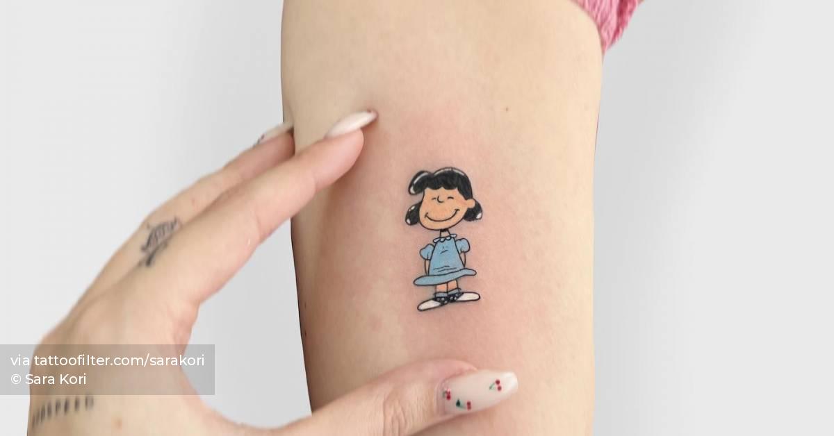 Lucy Van Pelt tattoo located on the inner arm, cartoon
