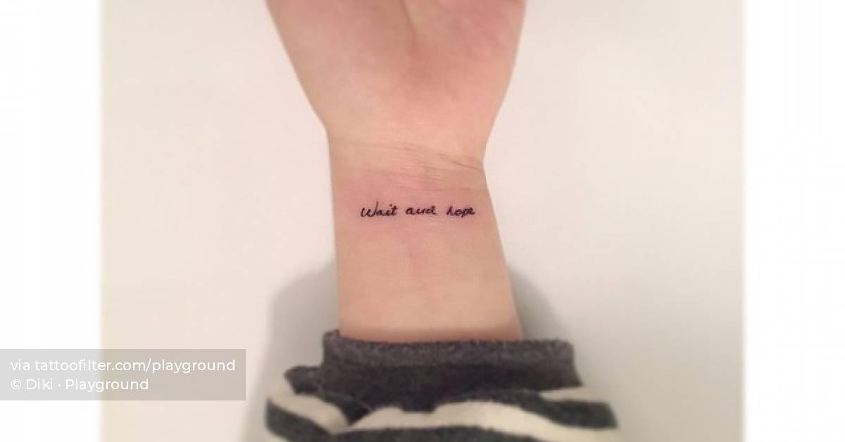 Lettering tattoo that says "wait and hope" located on