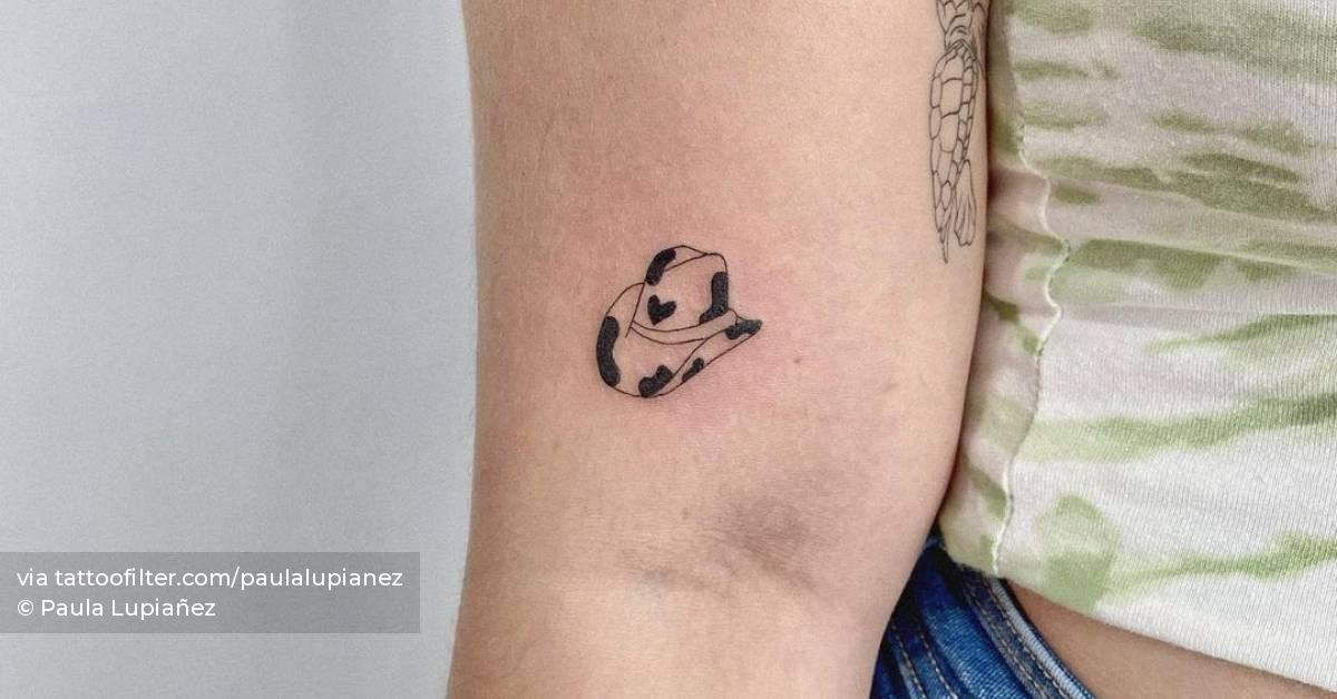 Illustrative style hat tattoo done on the bicep.