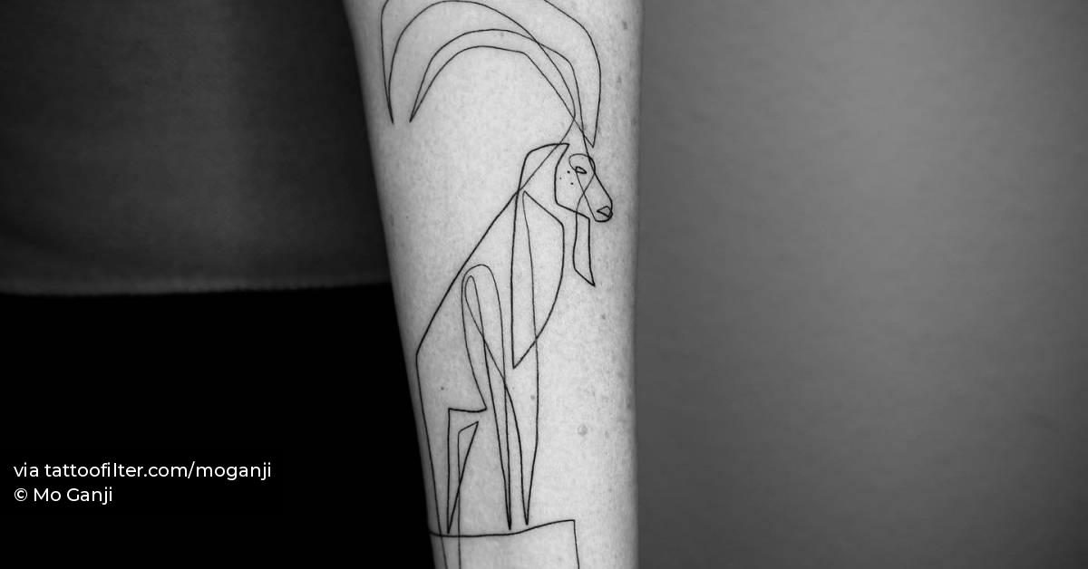Abstract goat tattoo located on the inner forearm.