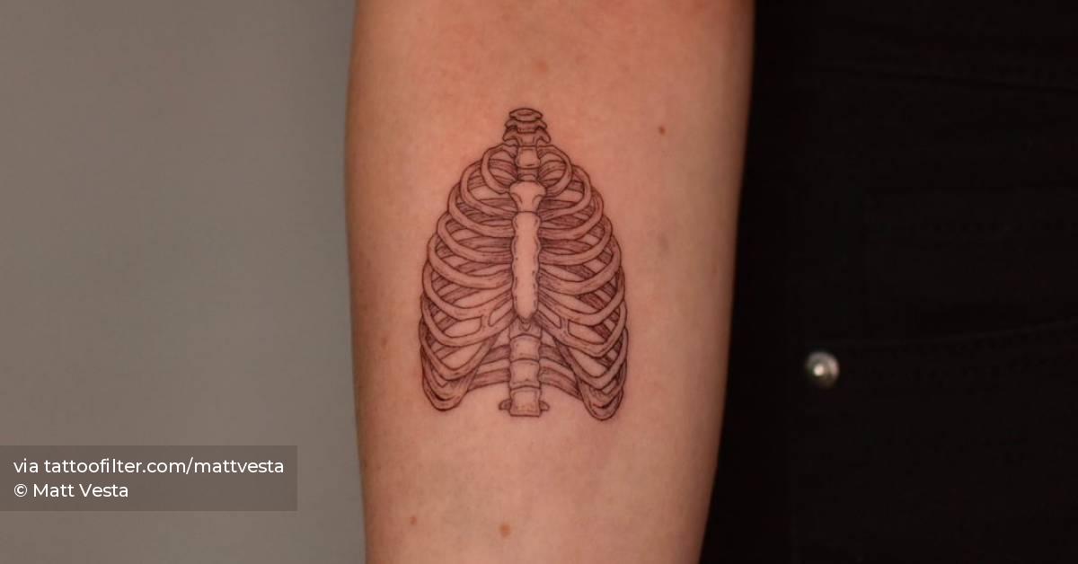 Illustrative style skeleton ribs tattoo located on the