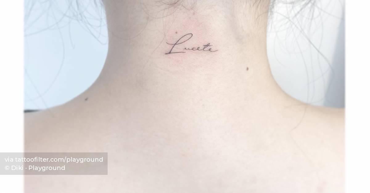 Word "lucete" lettering tattoo located on the back of