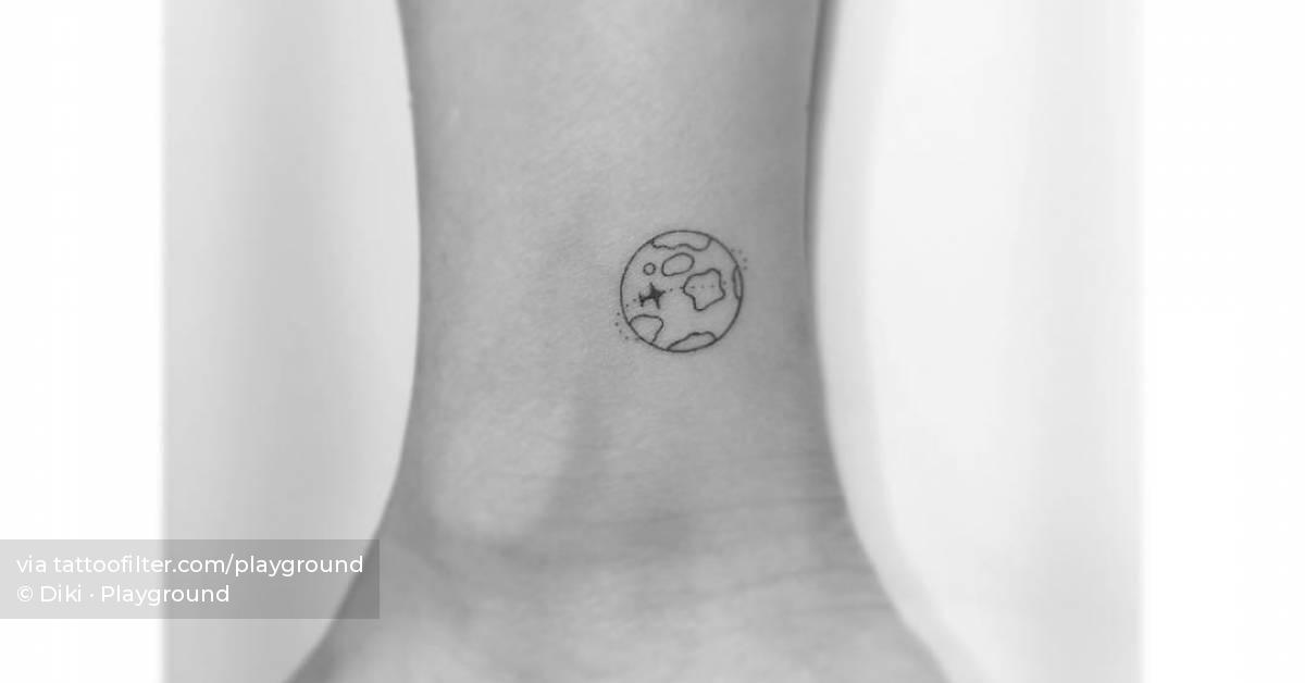 Minimalistic around the world tattoo placed on the