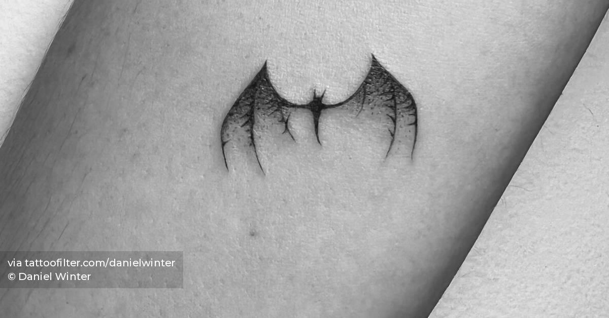 Bat tattoo located on the inner forearm.
