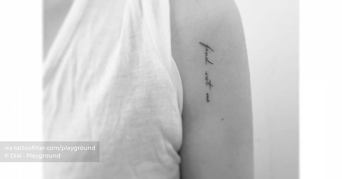 "Find out me" lettering tattoo located on the upper