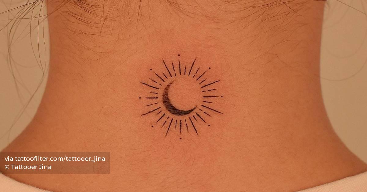 Sun and Moon ornament tattoo located on the back of the