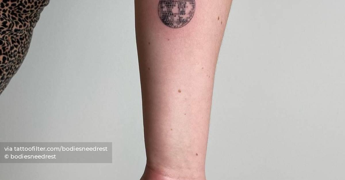 Micro-realistic disco ball tattoo done on the inner