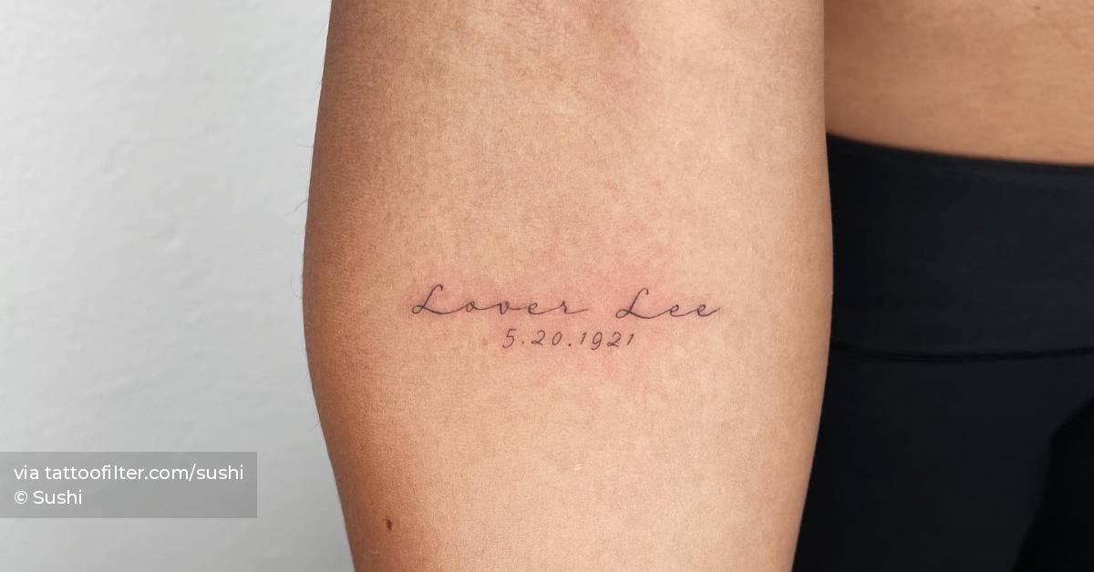 Lettering tattoo that says "Lover Lee" and date located