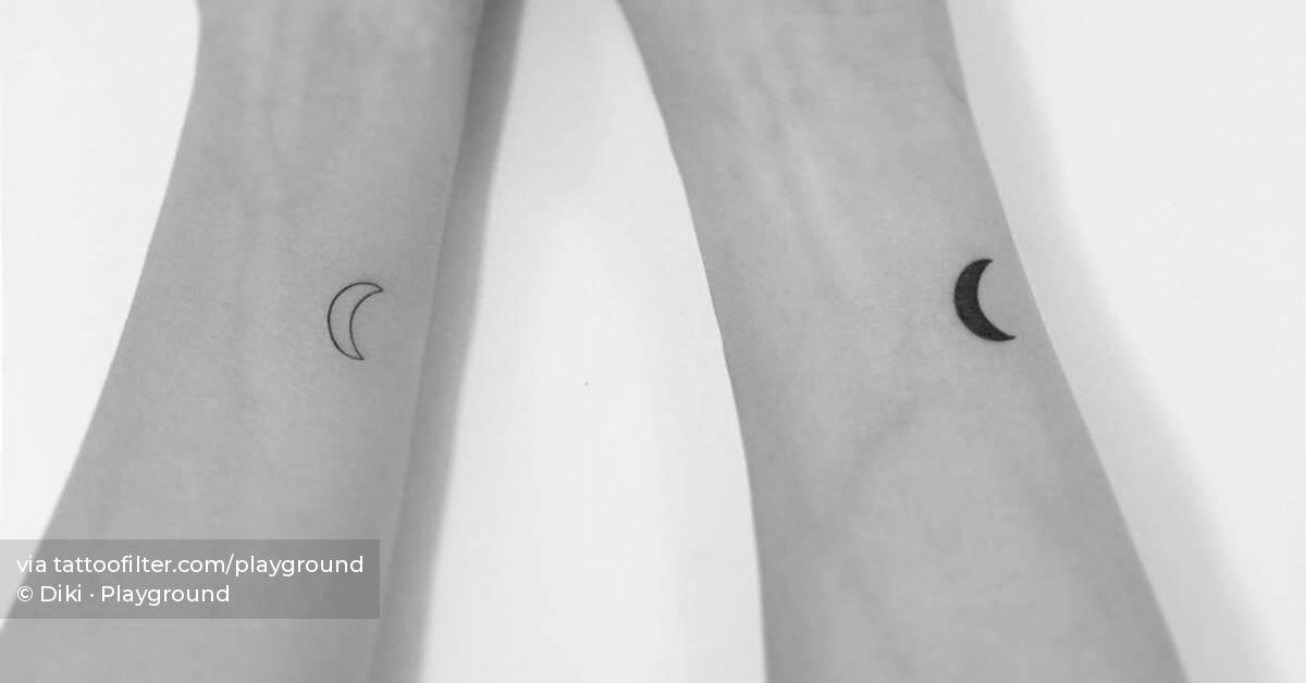 Matching crescent moon tattoo for couple.