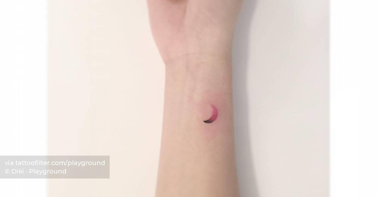 Tattoo of a crescent moon located on the wrist,