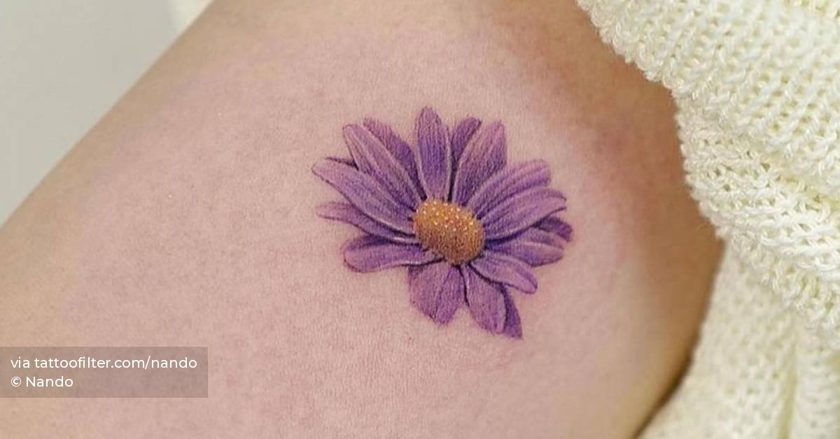 Micro-realistic daisy flower tattoo located on the