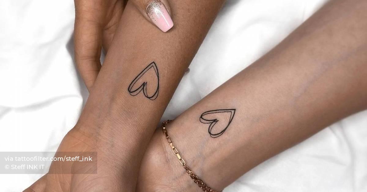 Minimalist matching heart tattoo for best friends.