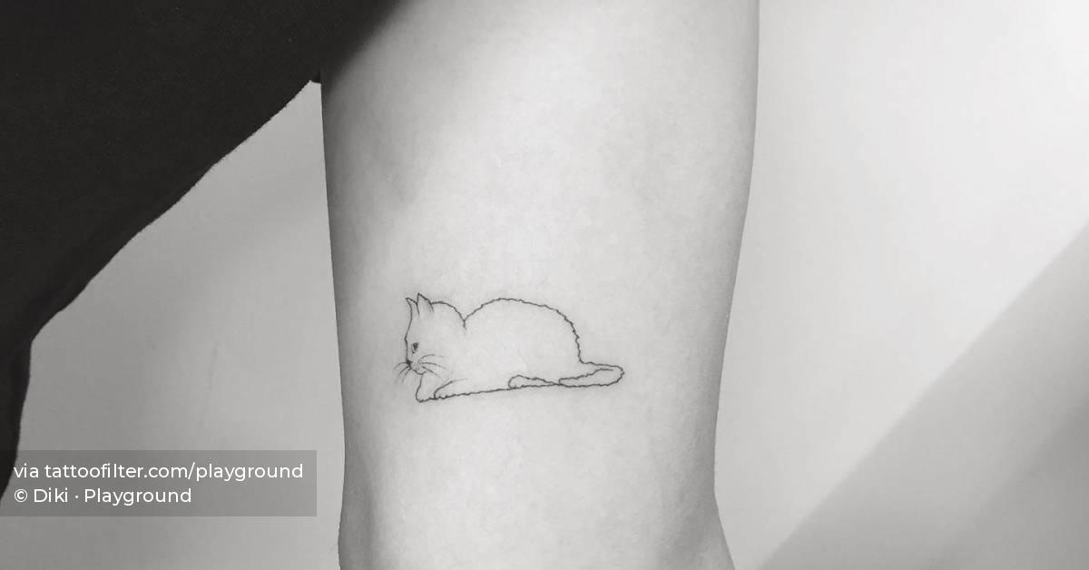 Fine line cat tattoo placed on the inner arm.