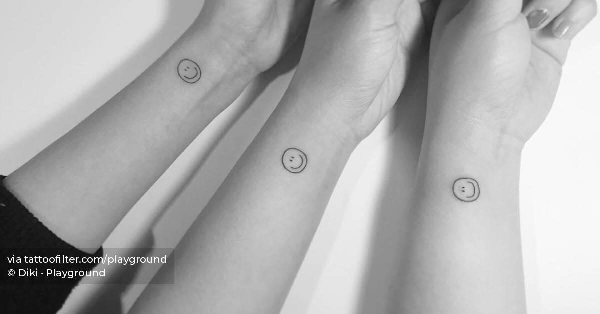 Matching smiley face tattoo for best friends.