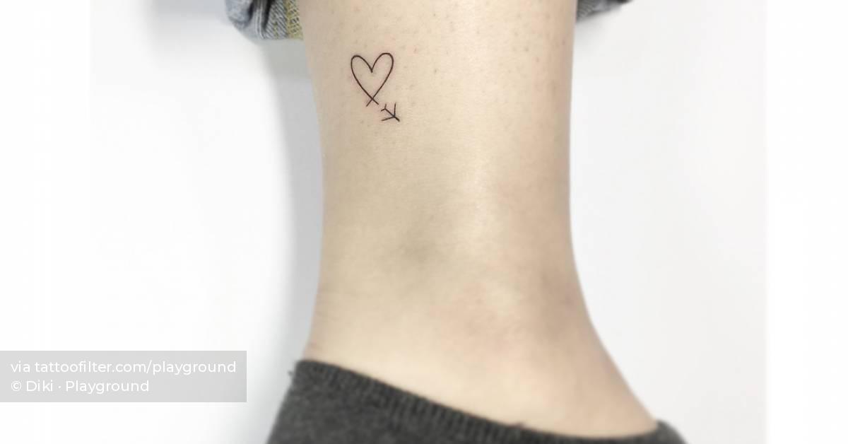 Fine line airplane and heart tattoo done on the ankle,
