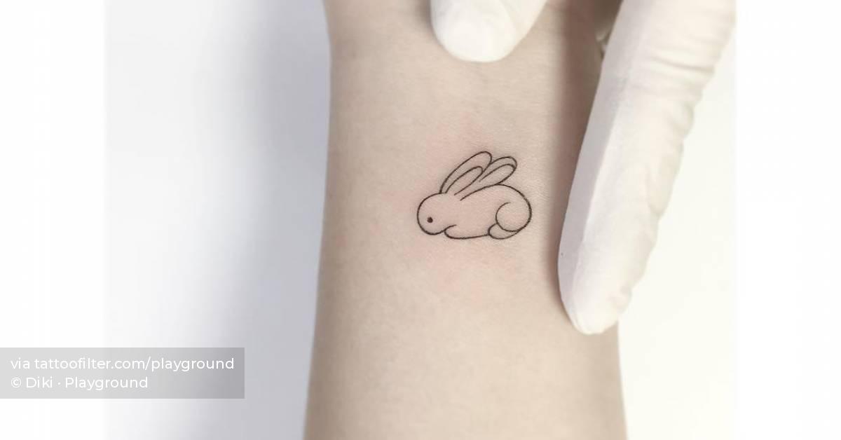 Fine line bunny tattoo located on the wrist,