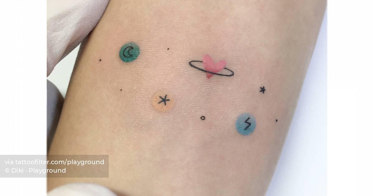 Colorful minimalistic universe tattooed on the inner