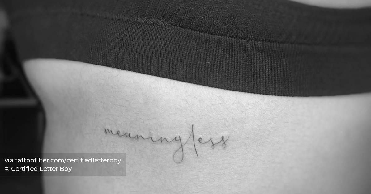 Tattoo of the word "meaningless" located on the rib.