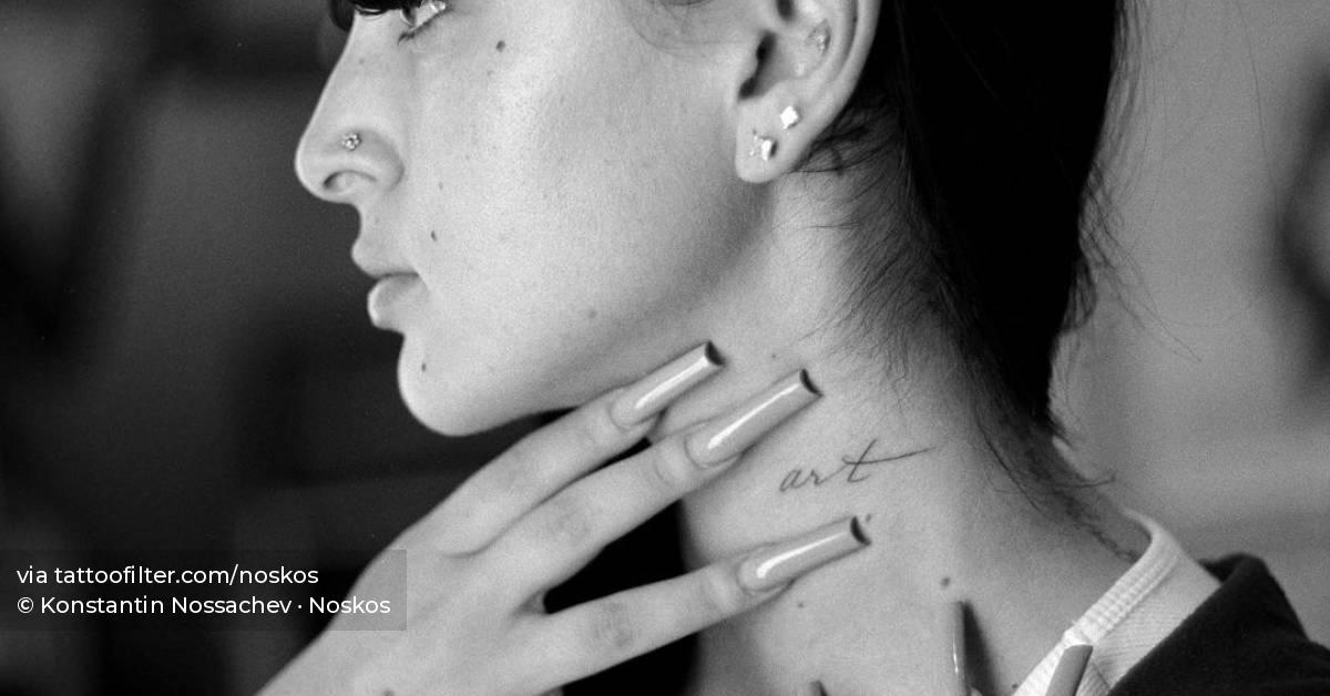 Tattoo of the word "art" located on Alycia Tyre's neck.