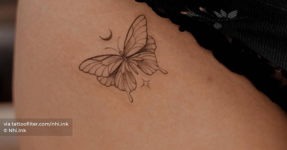 Butterfly tattoo located on the pelvis.