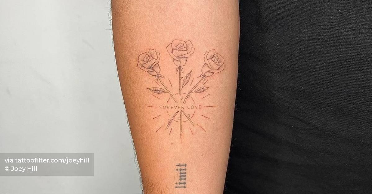 Single needle roses tattooed on the inner forearm.