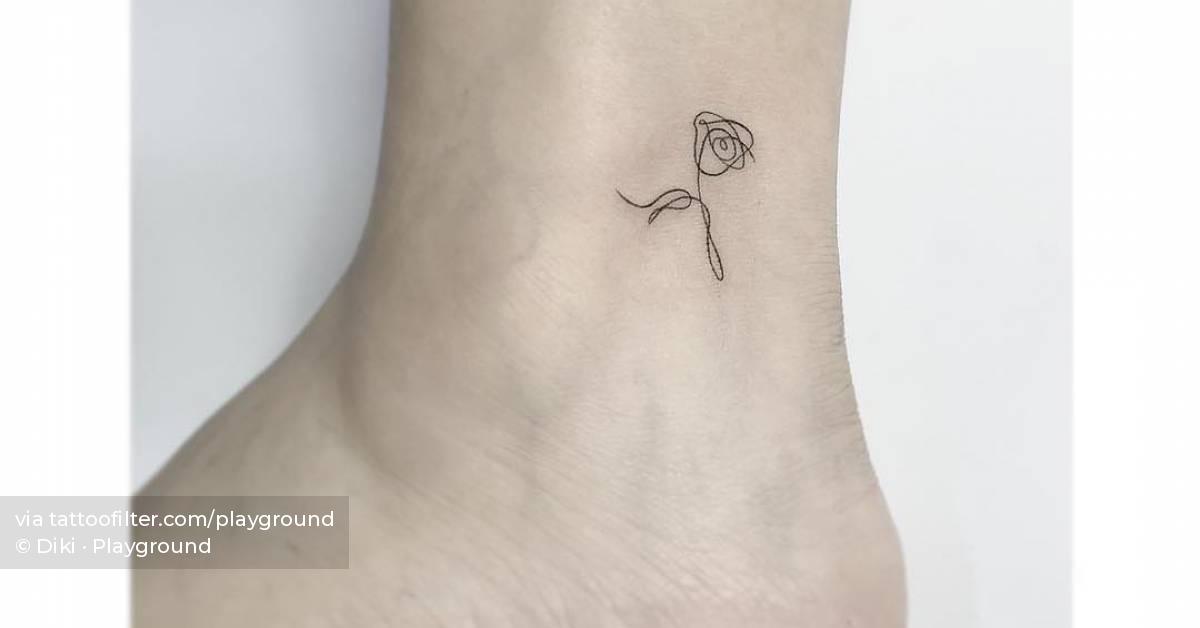 Abstract one line rose tattoo located on the ankle.