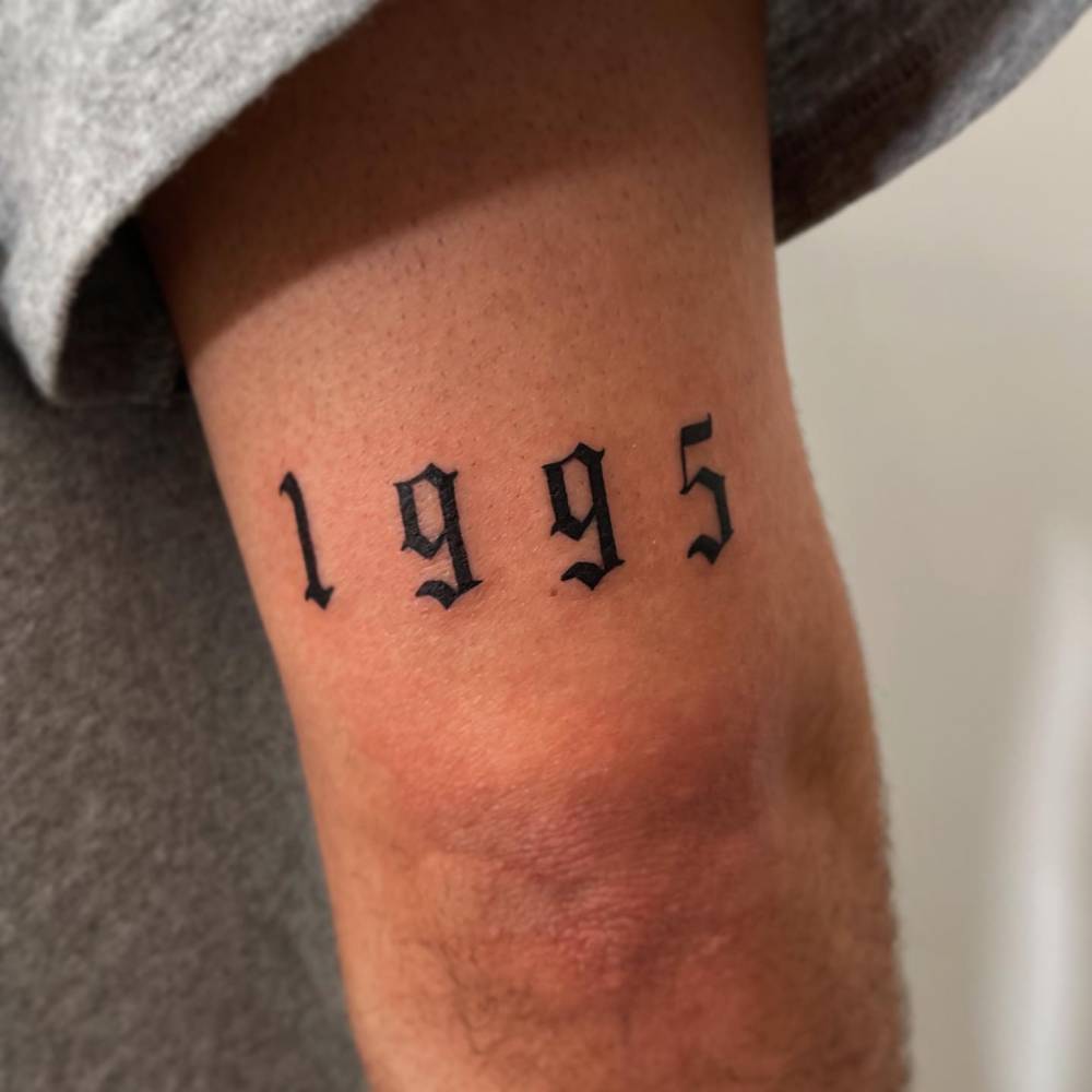 1995 Lettering Tattoo Located On The Tricep 1995 Lettering Tattoo Located On The Tricep