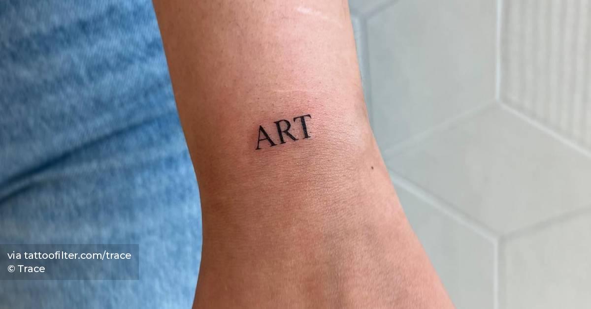 Tattoo of the word "art" located on the wrist.