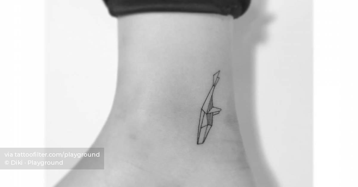 Low poly whale tattoo located on the ankle.