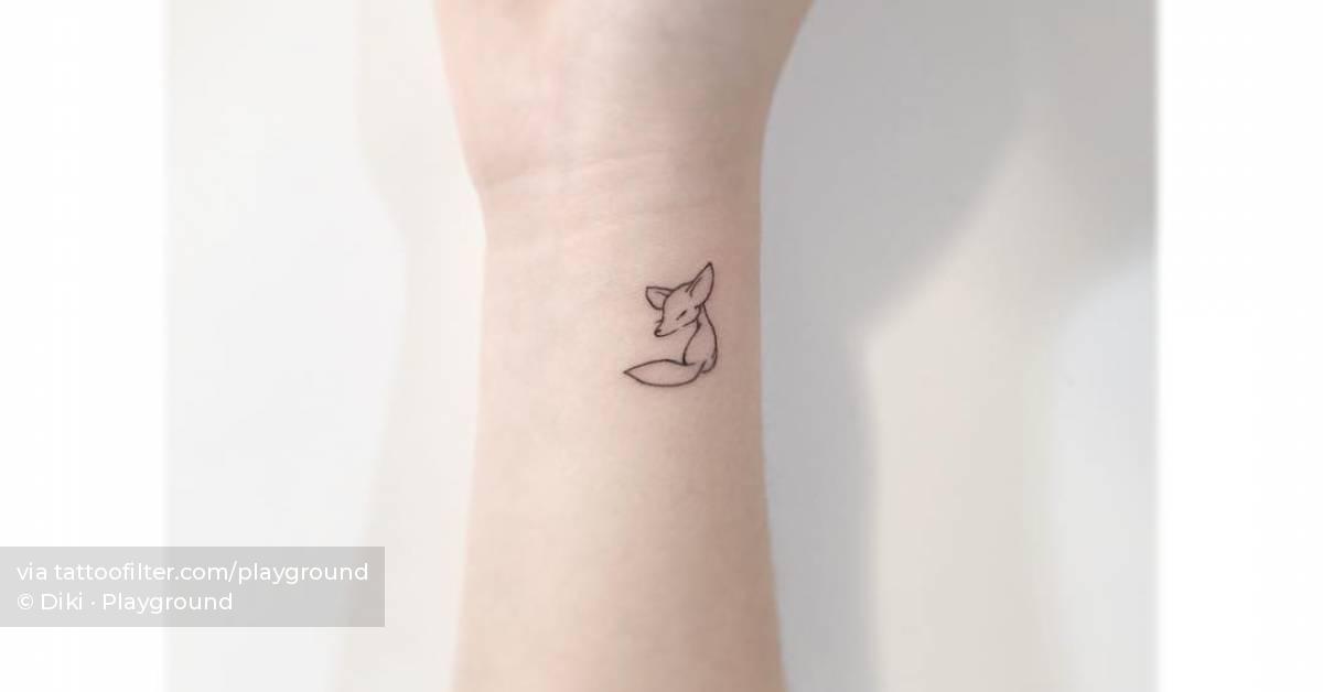 Little fox tattoo located on the wrist, minimalistic