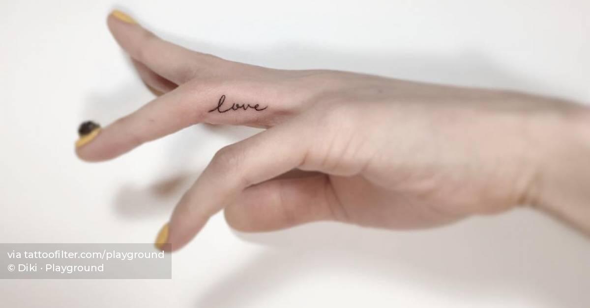 Word "love" tattooed on the finger.
