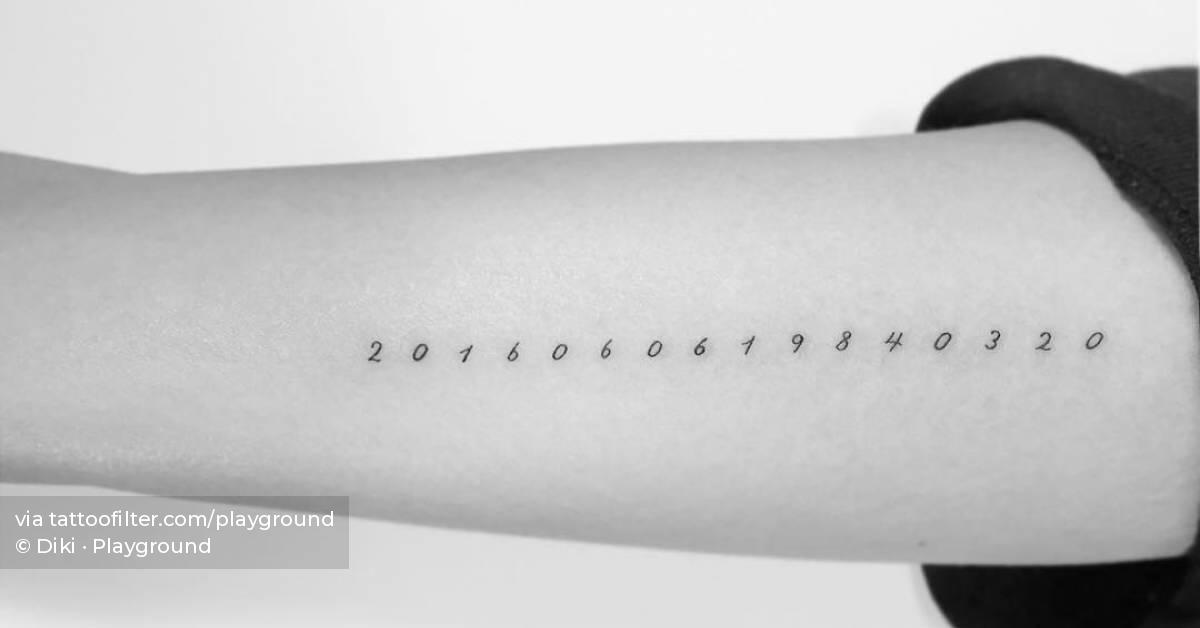 Dates tattoo located on the inner arm.