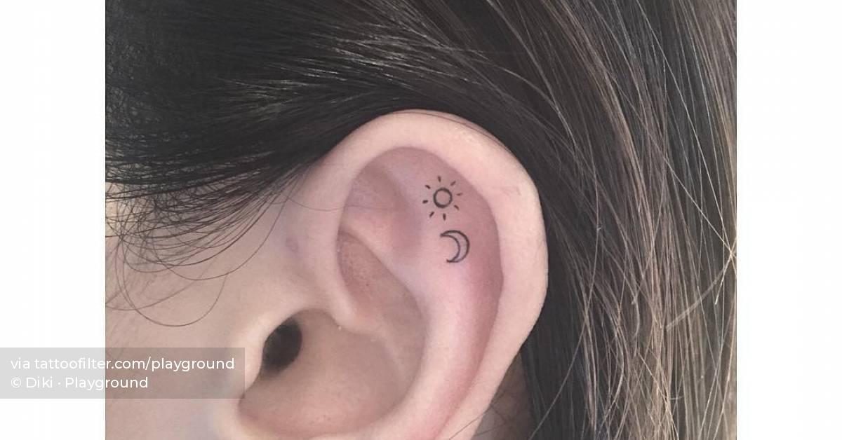 Sun and moon tattoo placed on the ear, minimalistic